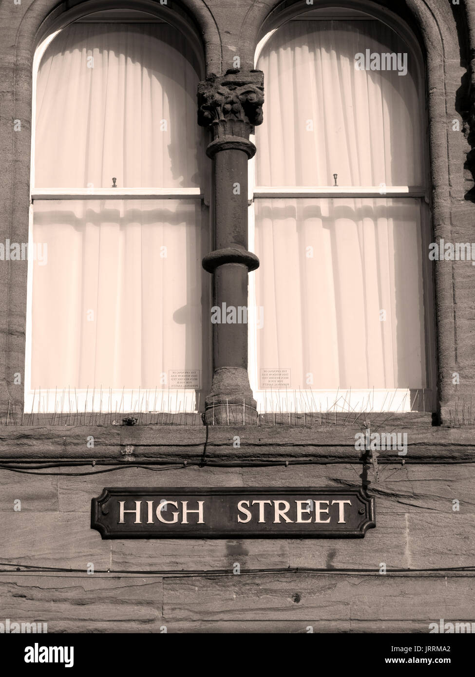 High Street place name on historic stone building Stock Photo - Alamy