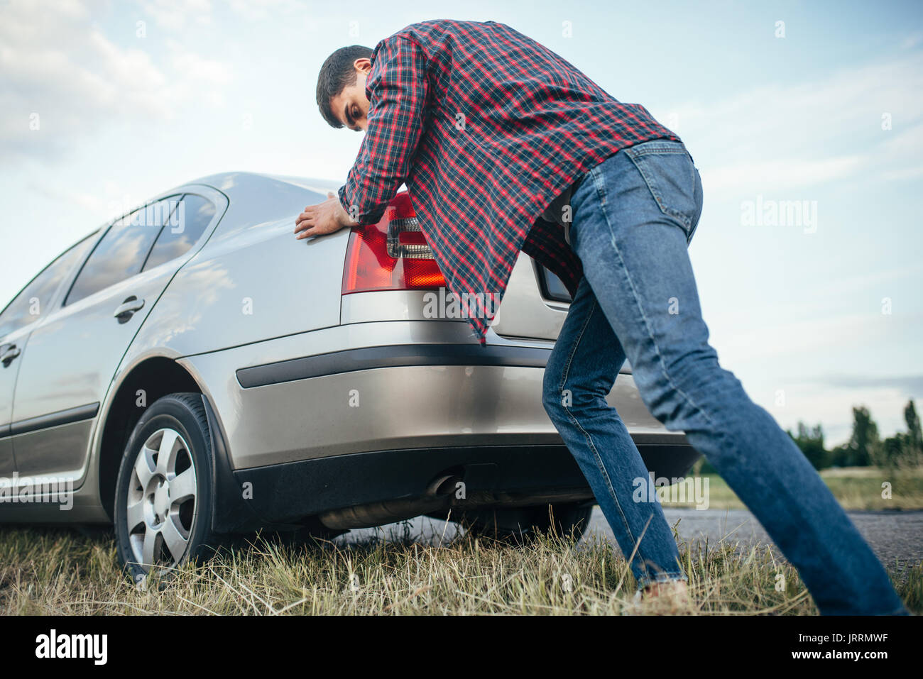 Man Pushing Car
