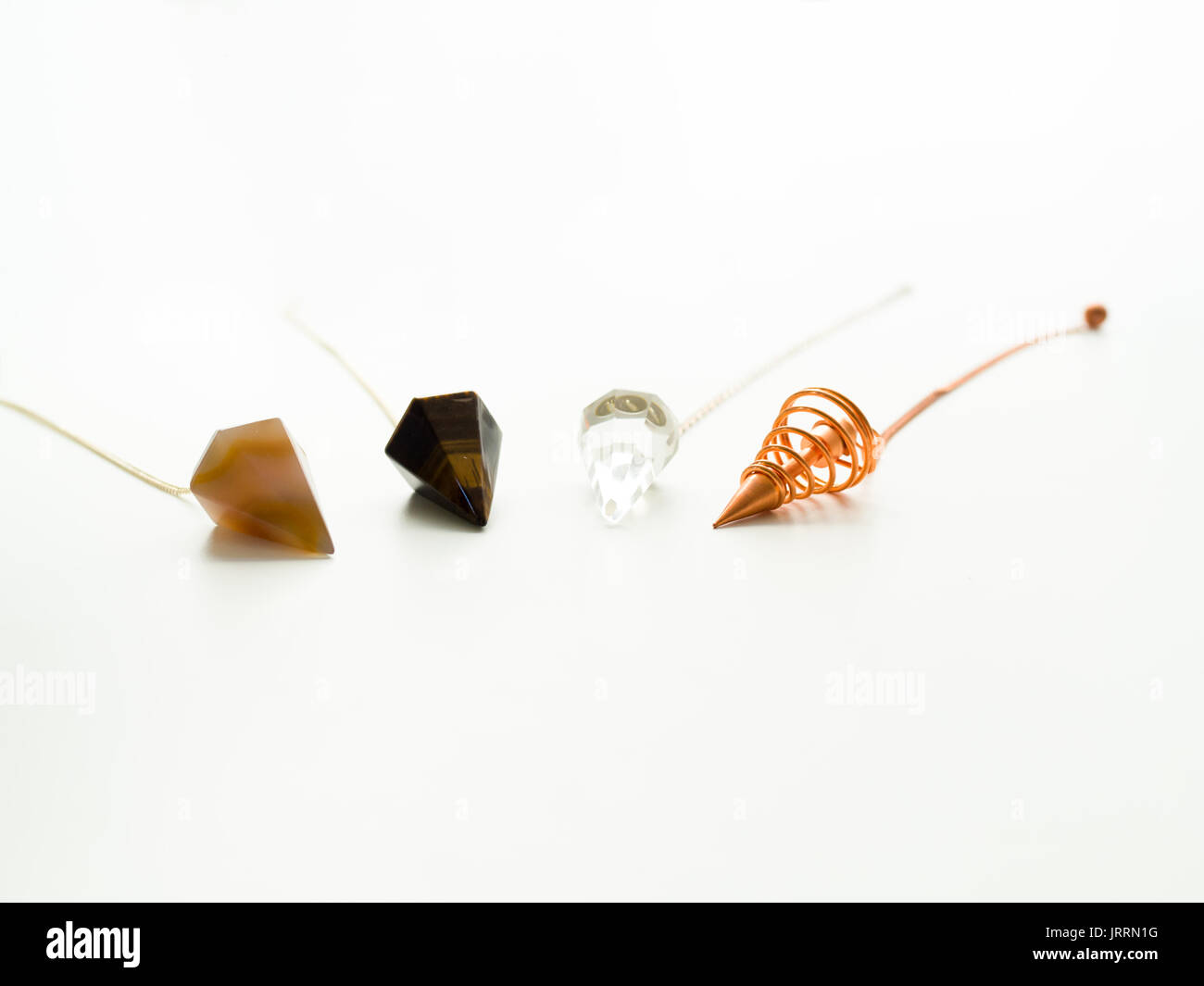 Tumbled pendulum stones for crystal therapy treatments and reiki detail ...