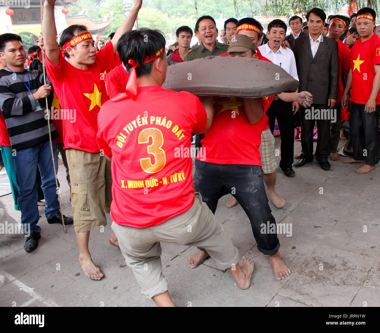 HAI DUONG, VIETNAM, February, 25: Vietnamese farmers play firecracker ...