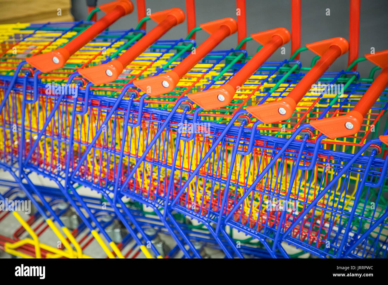 many shopping colorful shopping trolleys together Stock Photo - Alamy