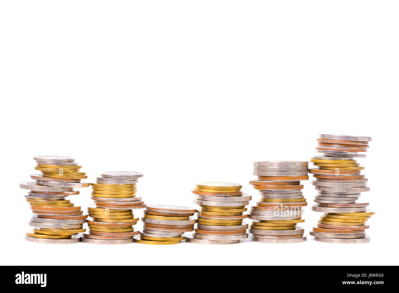 Columns of coins, piles of coins arranged on white background, business ...
