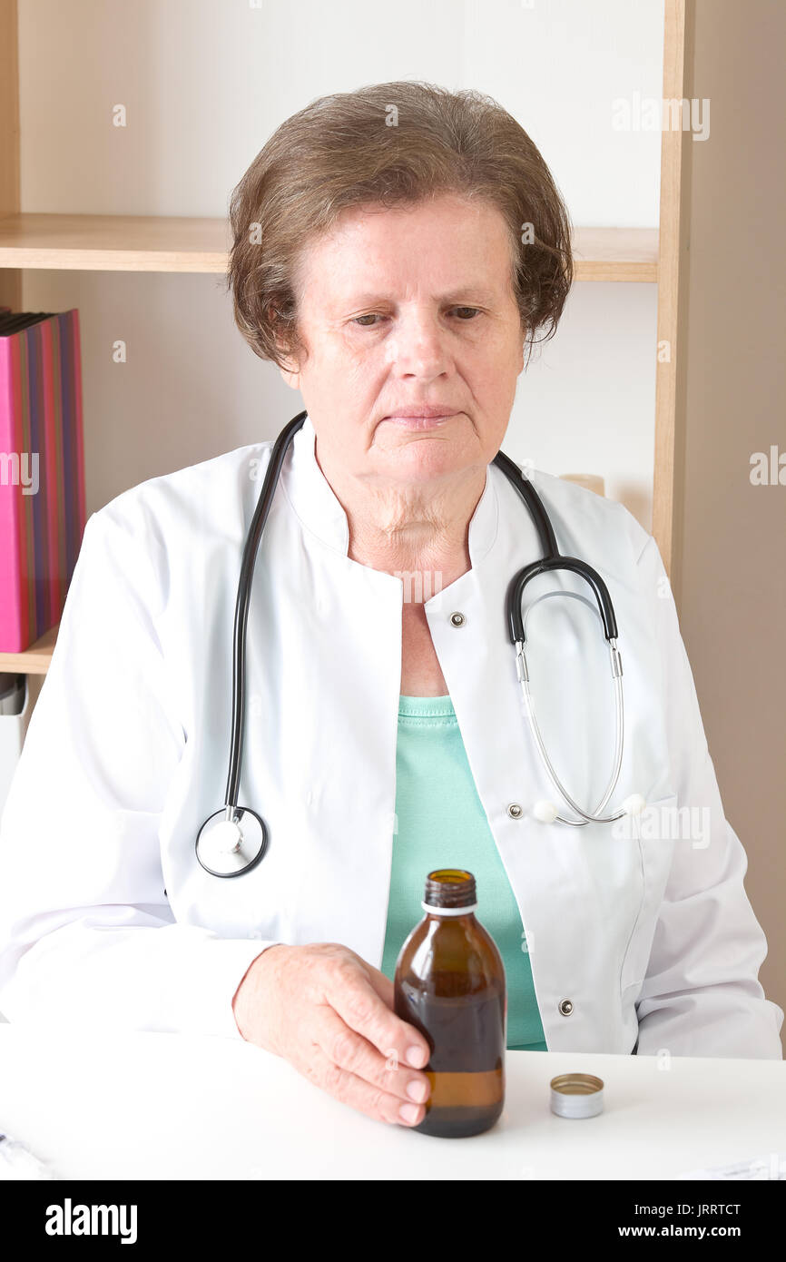 Female doctor with Cough Syrup Stock Photo - Alamy