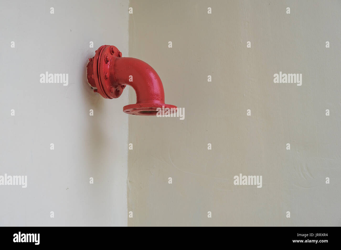 Red metal vent round industrial pipe on the white wall Stock Photo - Alamy