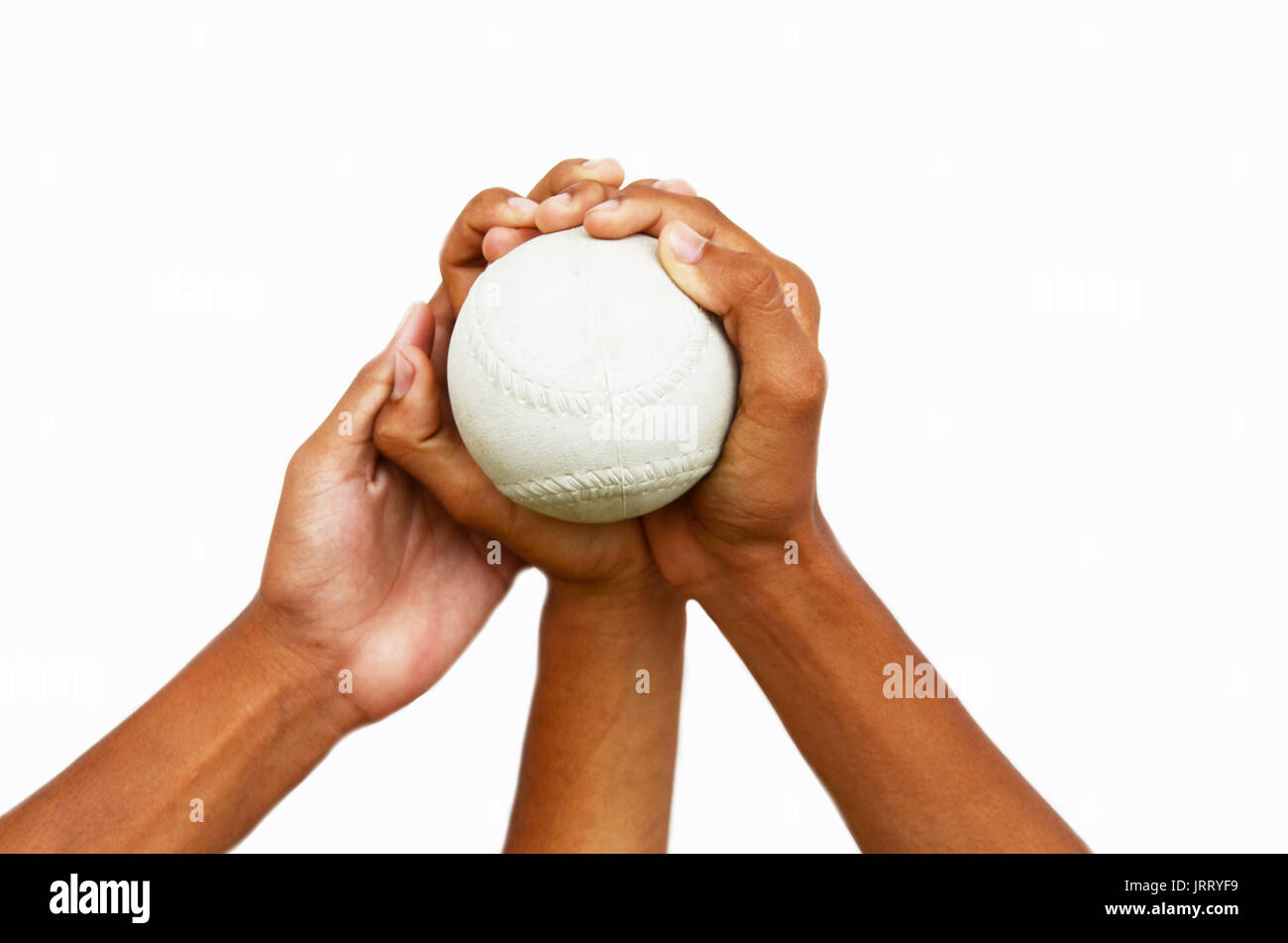 softball in hand on white background Stock Photo - Alamy