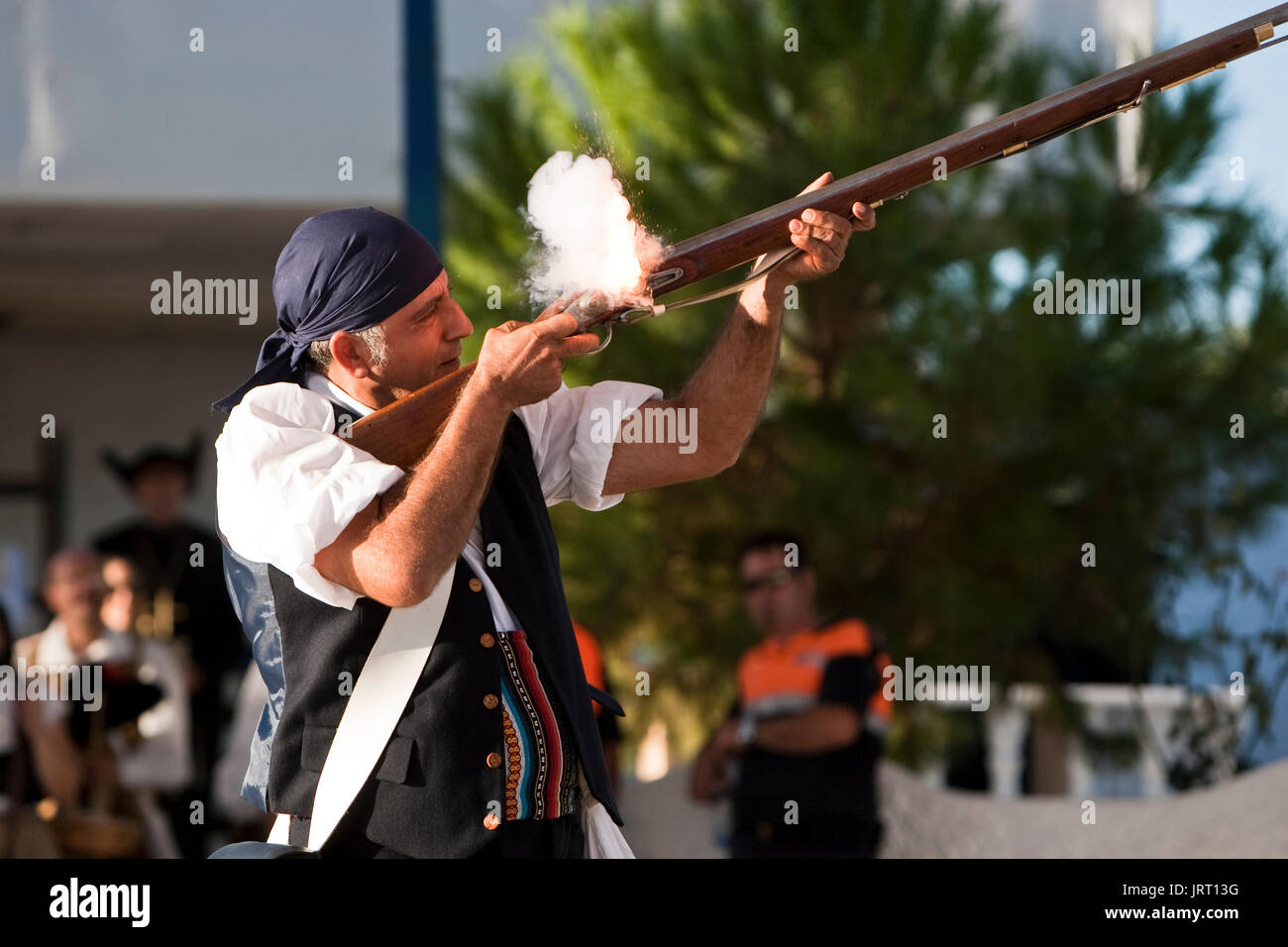 Spanish soldier firing a gun during the Representation of the Battle of ...