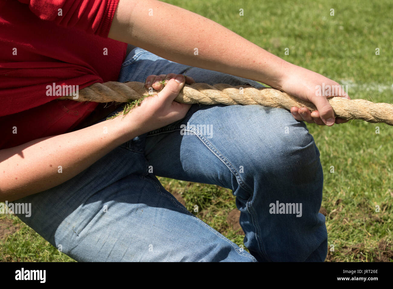 Man pulling on rope in a tug of war contest Stock Photo - Alamy