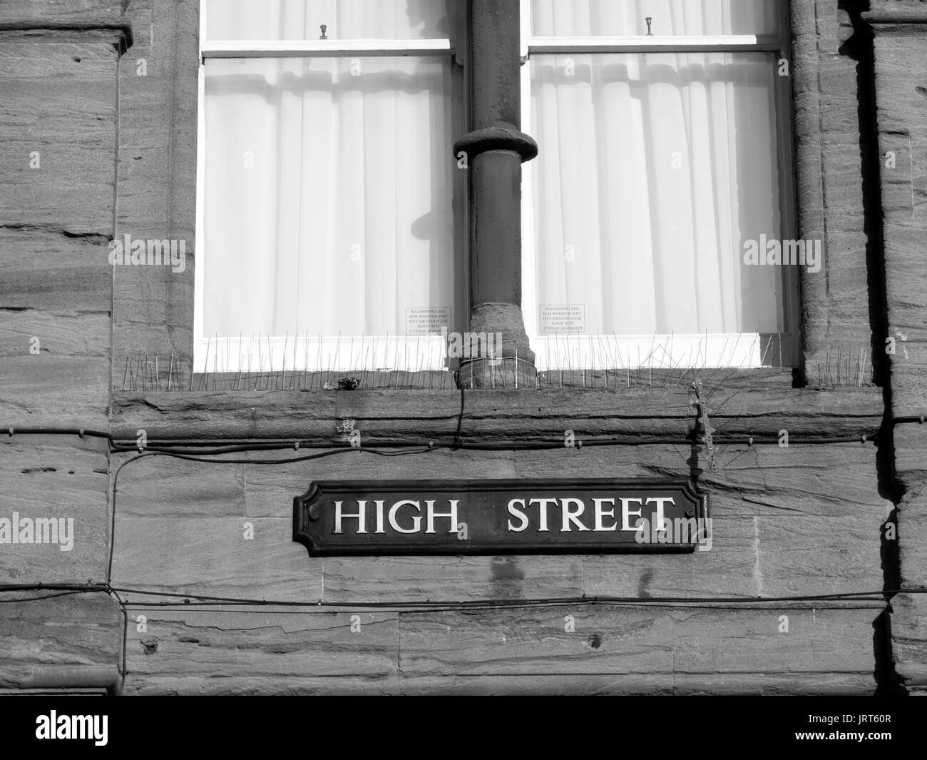 High Street place name on historic stone building Stock Photo - Alamy