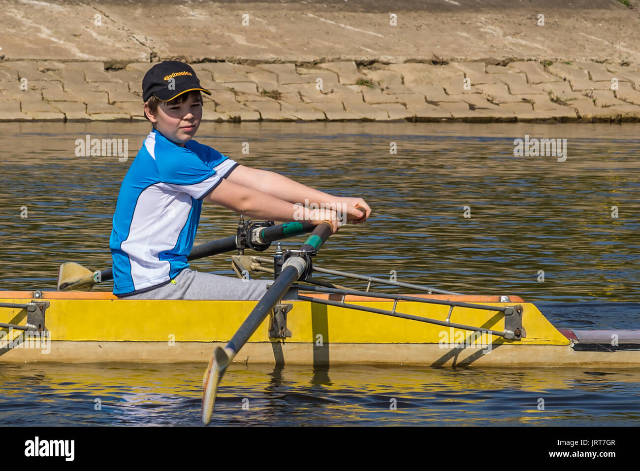 A boy in a row club in Poland. Hard work on a sport form in rowing and ...