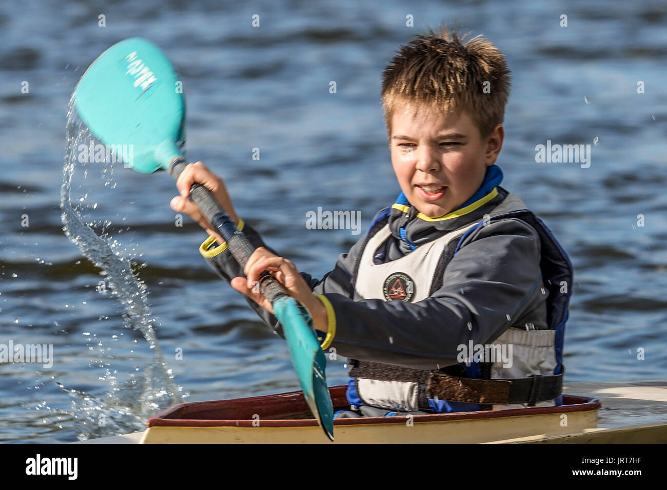 A boy in a row club in Poland. Hard work on a sport form in rowing and ...