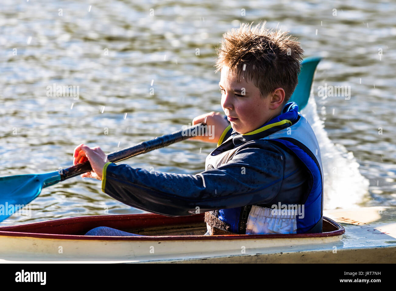 A boy in a row club in Poland. Hard work on a sport form in rowing and ...