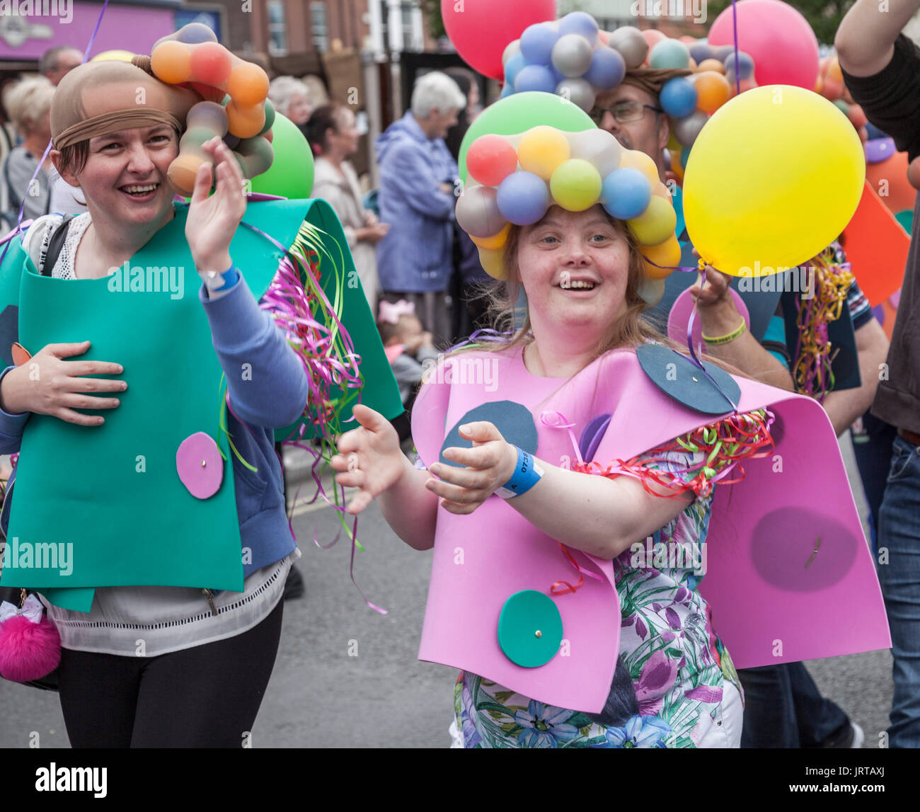 People in colourful outfits walk down the High Street at the Stockton ...