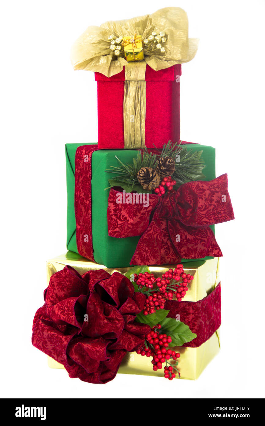 A gold foil-wrapped gift topped by a red damask bow, a green-wrapped ...