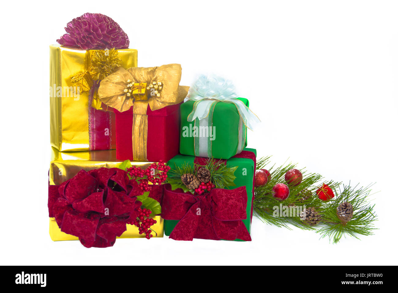 A gold foil-wrapped gift topped by a red damask bow, a green-wrapped ...
