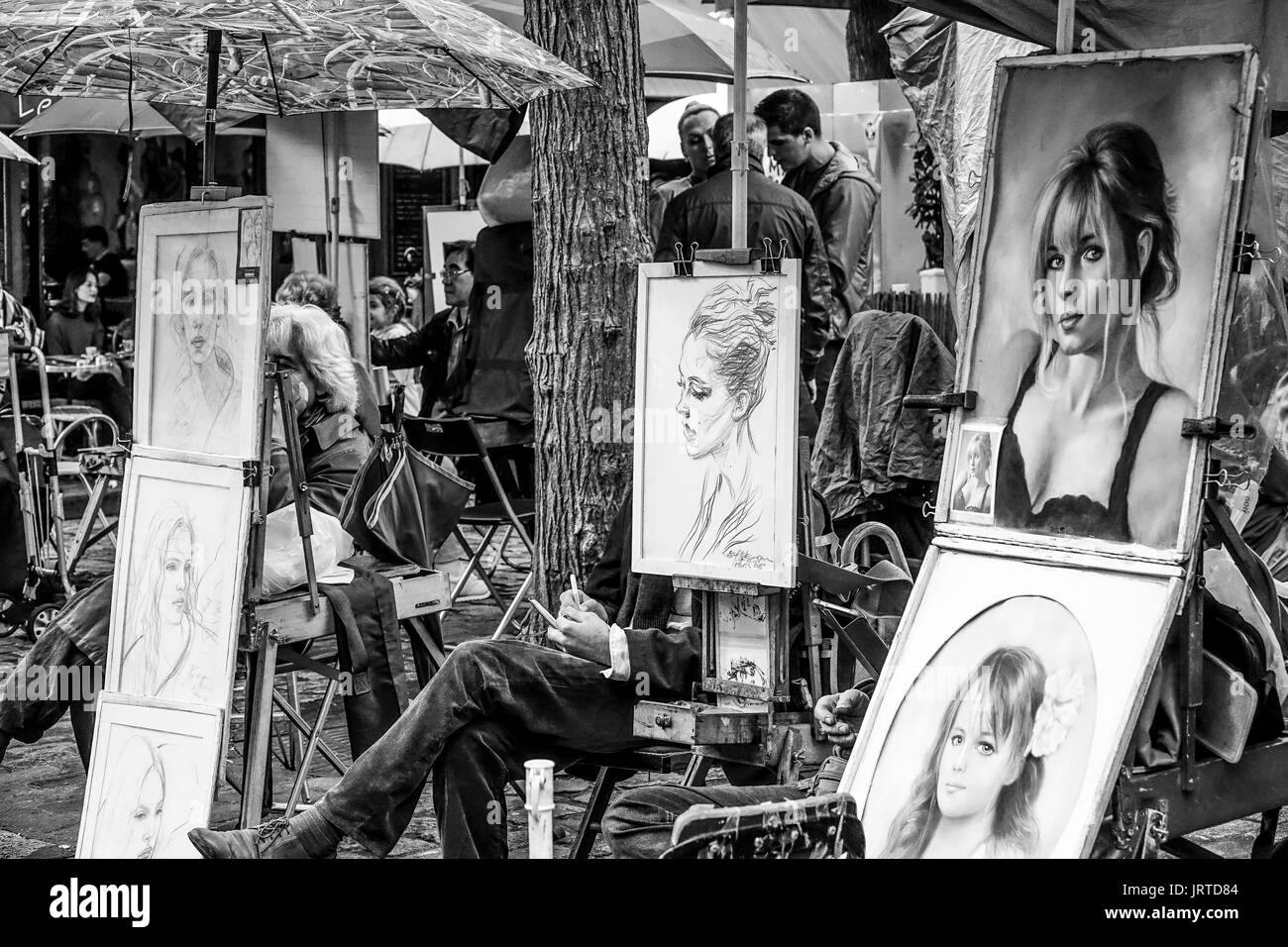 Artists drawing portraits at Place du Tertre on Montmartre in Paris ...