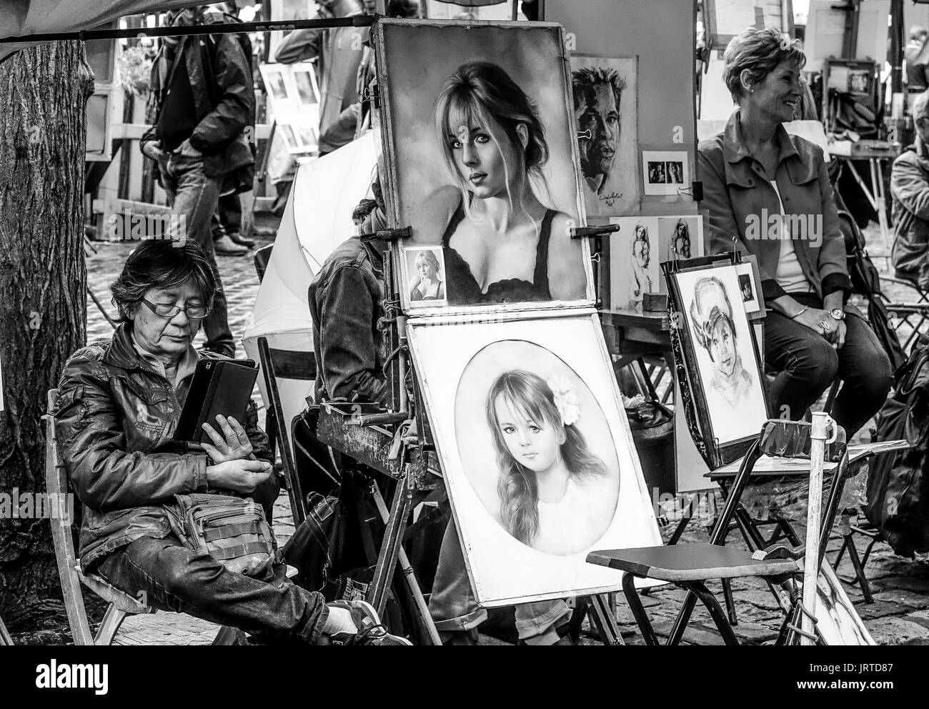 Artists drawing portraits at Place du Tertre on Montmartre in Paris ...