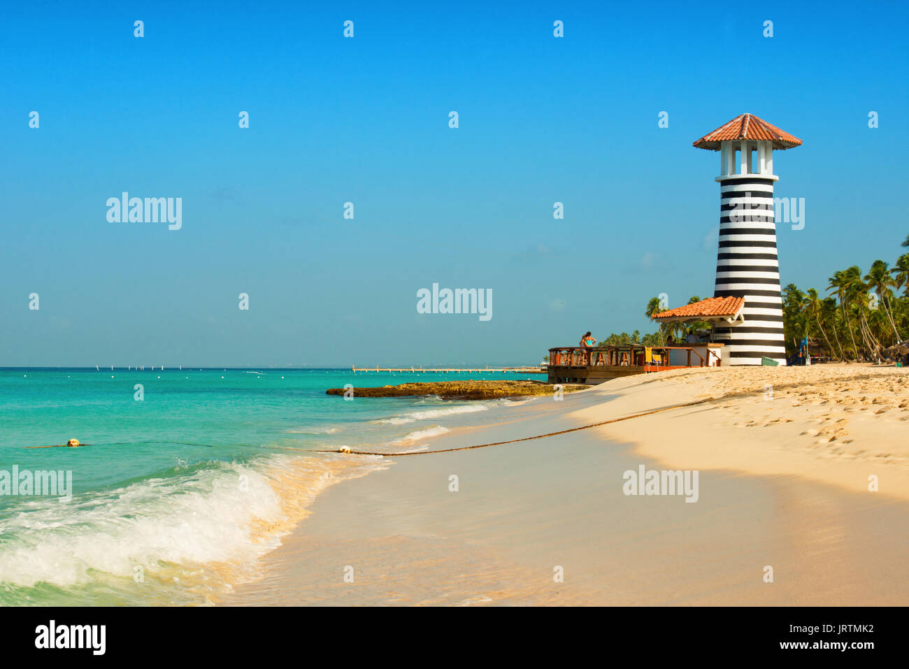 Striped red white lighthouse on the coast of the Caribbean Sea ...