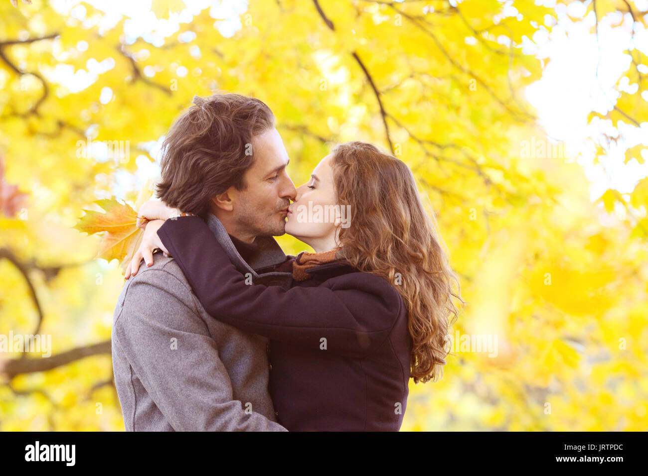 Love, relationship, family and people concept - couple kissing in ...