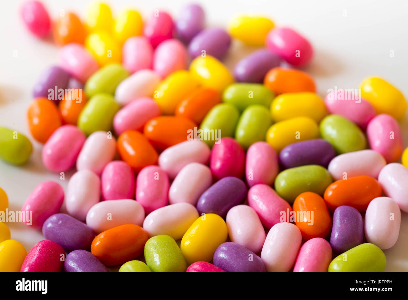 group of multicolored candies closeup Stock Photo - Alamy
