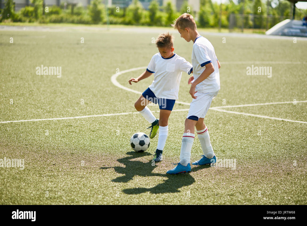 Boys Fighting for Ball in Football Stock Photo - Alamy
