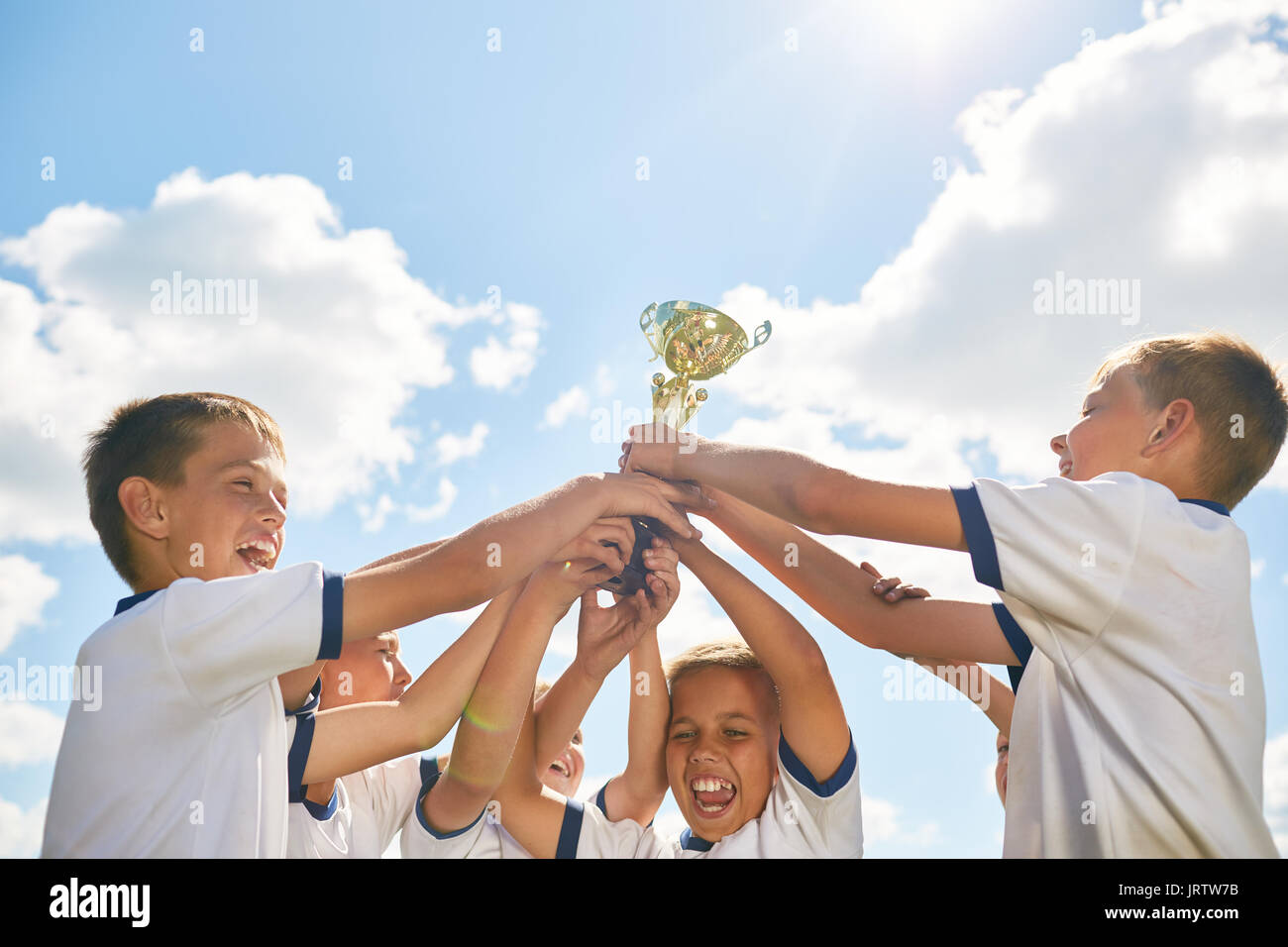 Boys soccer team celebrating trophy hi-res stock photography and images ...