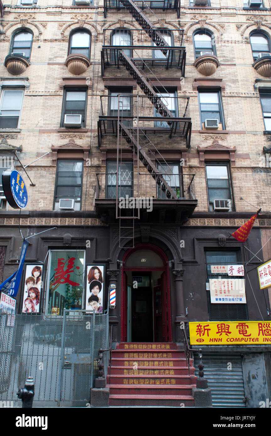 Building facades with fire escapes in China Town, New York City, USA ...