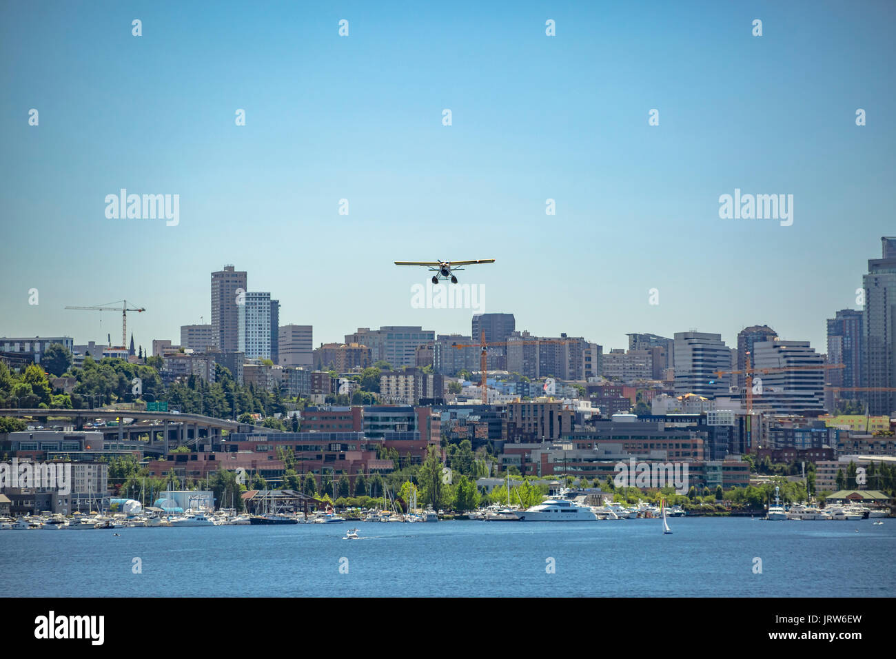 Float plane taking off in Seattle on t he bay. Float plane taking off ...