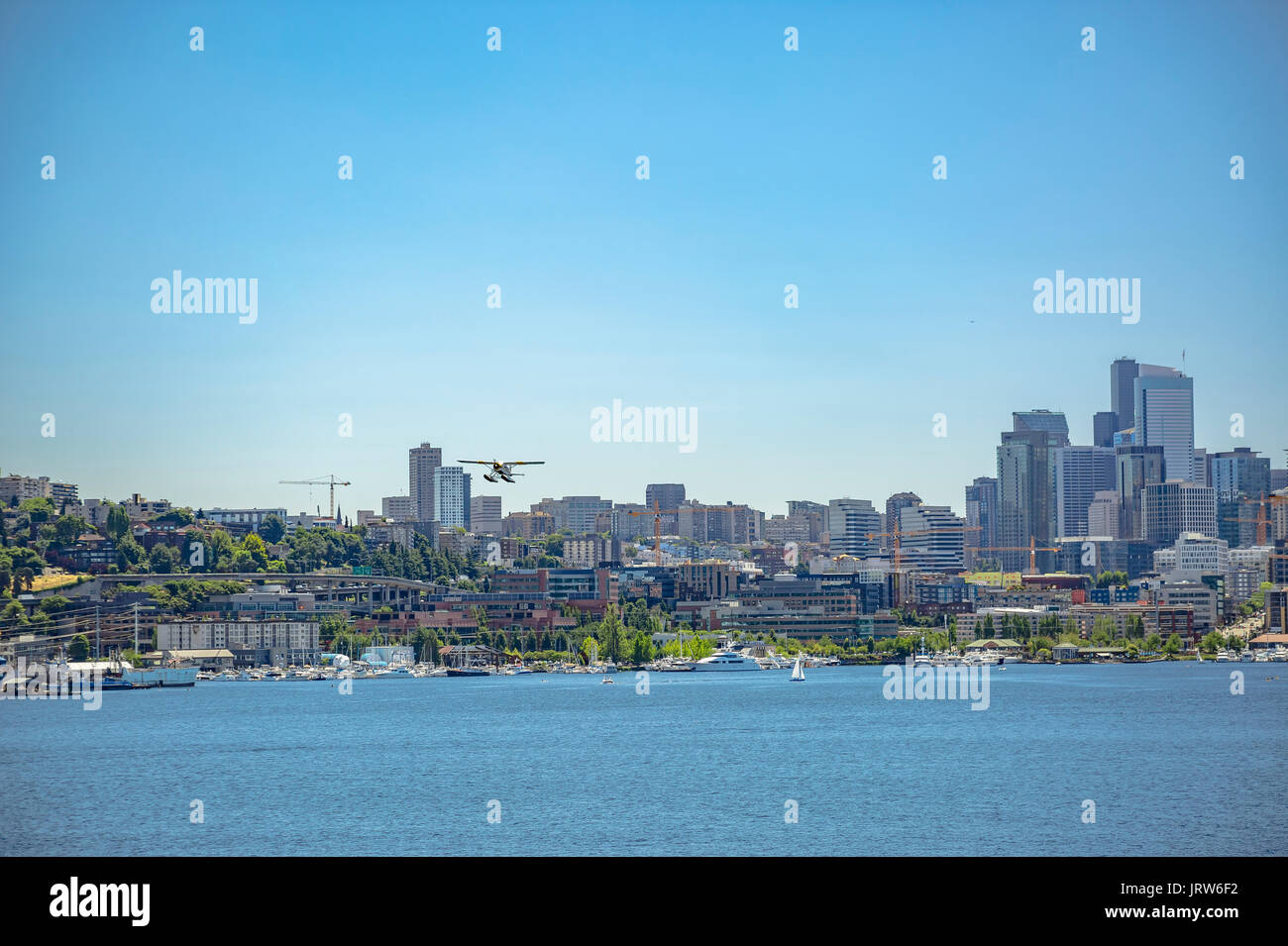 Float plane taking off in Seattle. Float plane taking off from the bay ...