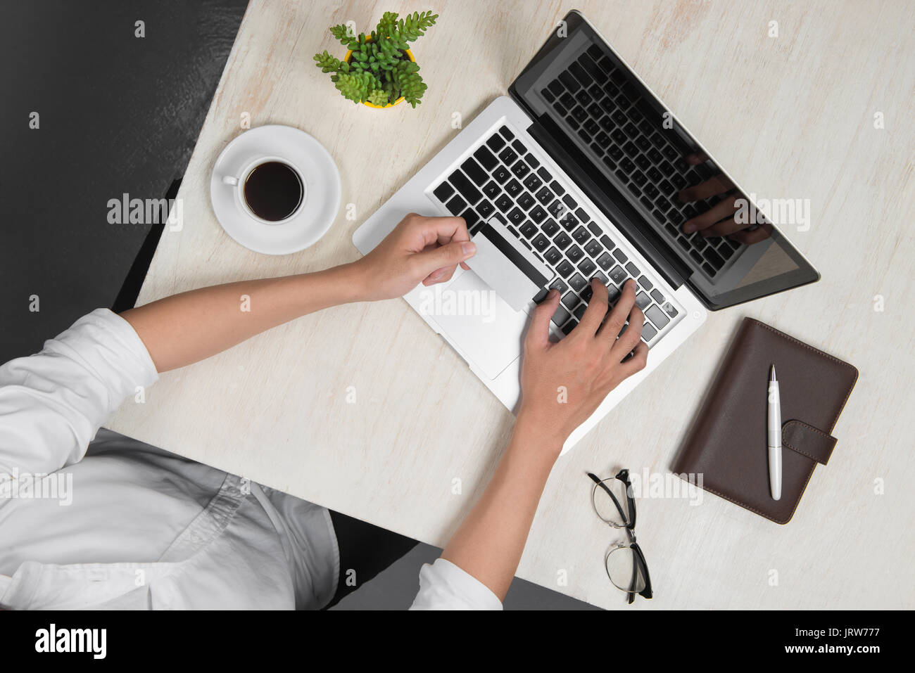 Top view of man using a modern portable computer in home office ...