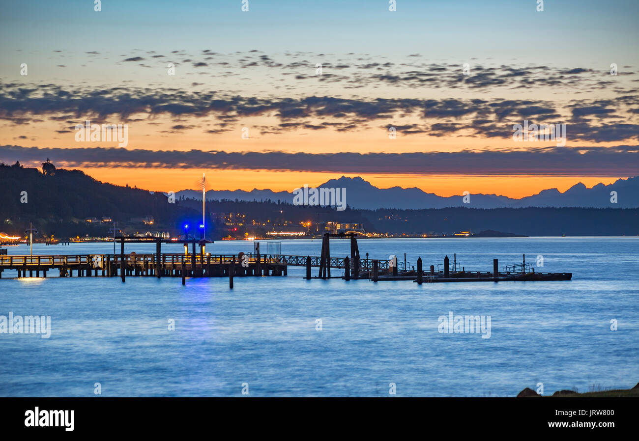 Tacoma docks at sunset with the mountains. The bay in Tacoma Washington ...