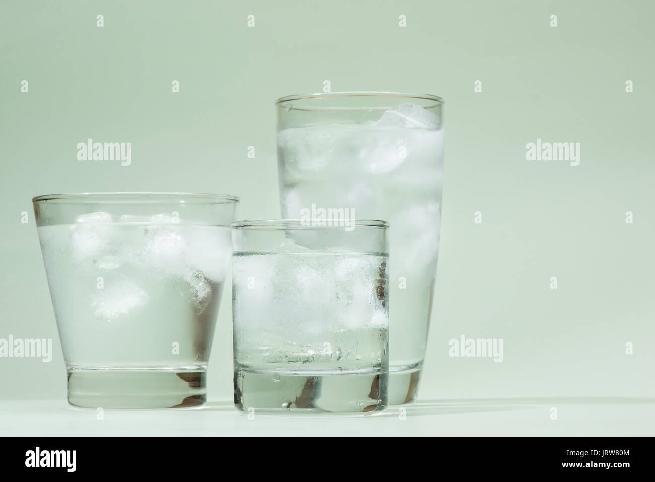Cold fresh drinking water in glass on table Stock Photo - Alamy