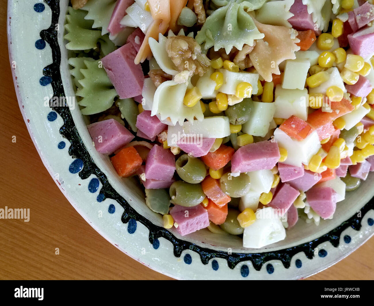 Salad of pasta and russian salad, olivier salad Stock Photo - Alamy