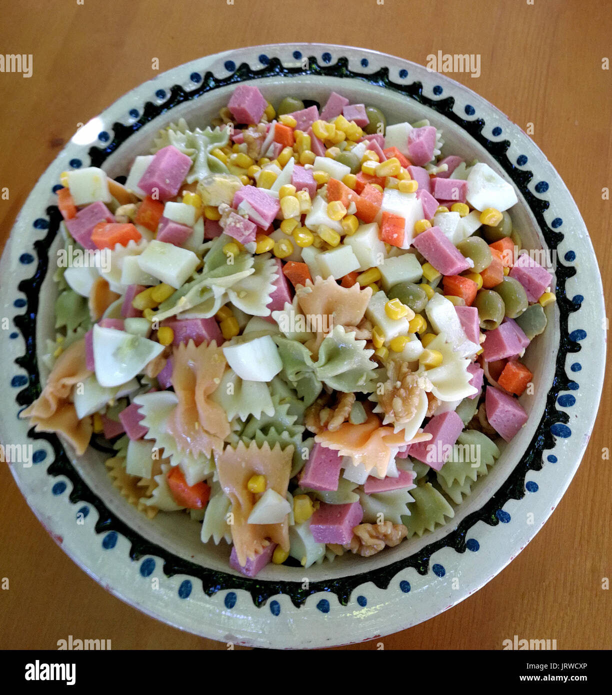 Salad of pasta and russian salad, olivier salad Stock Photo - Alamy