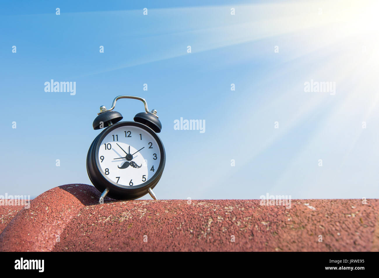 Alarm clock and sun light Stock Photo - Alamy