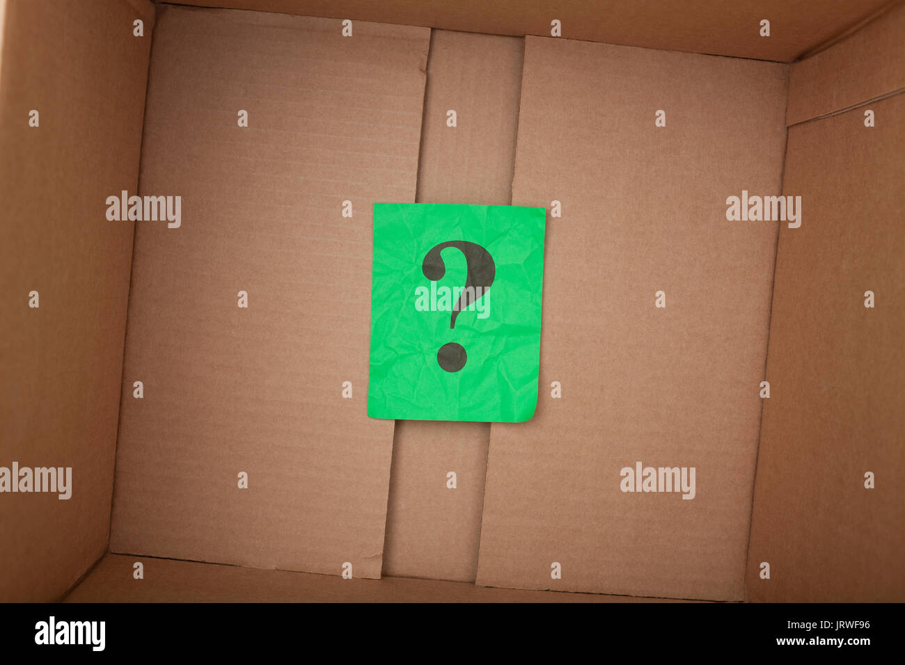 Question mark inside of a cardboard box. Close up Stock Photo - Alamy