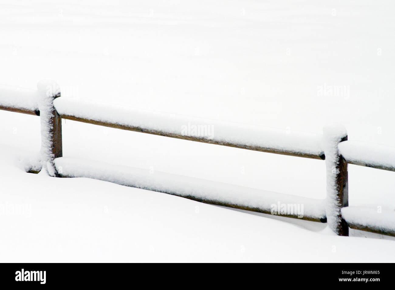 Snow covered wooden fence Stock Photo - Alamy