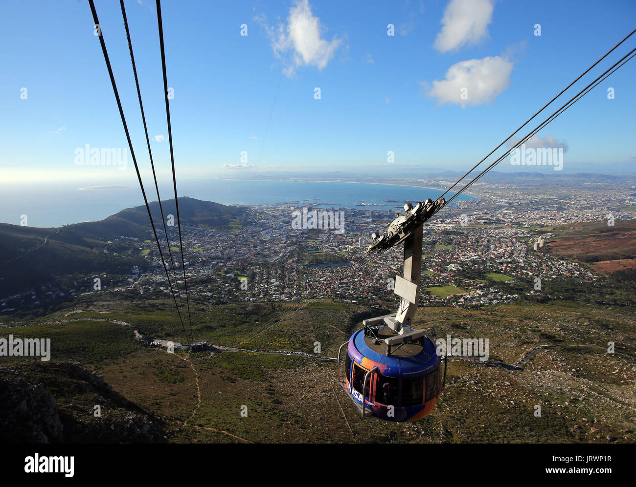 A view of a cable car making its way up to the peak of Table Mountain ...