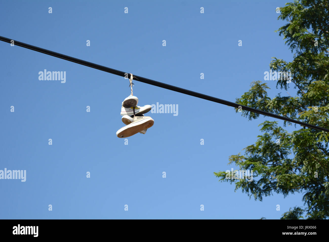 Sneakers Hanging Telephone Wire Stock Photos & Sneakers Hanging ...