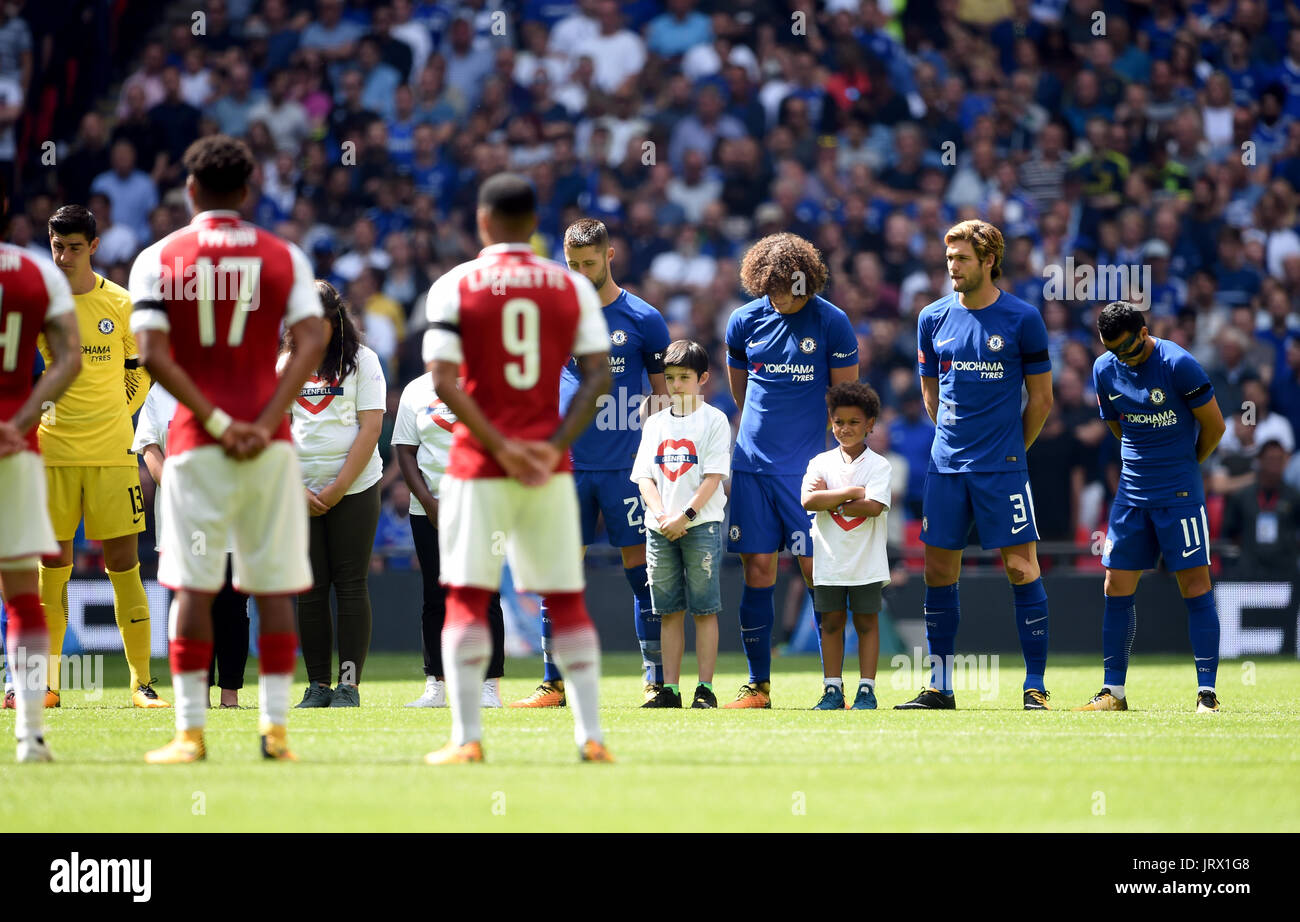 Chelsea and Arsenal players observe a minutes silence in memory of the ...