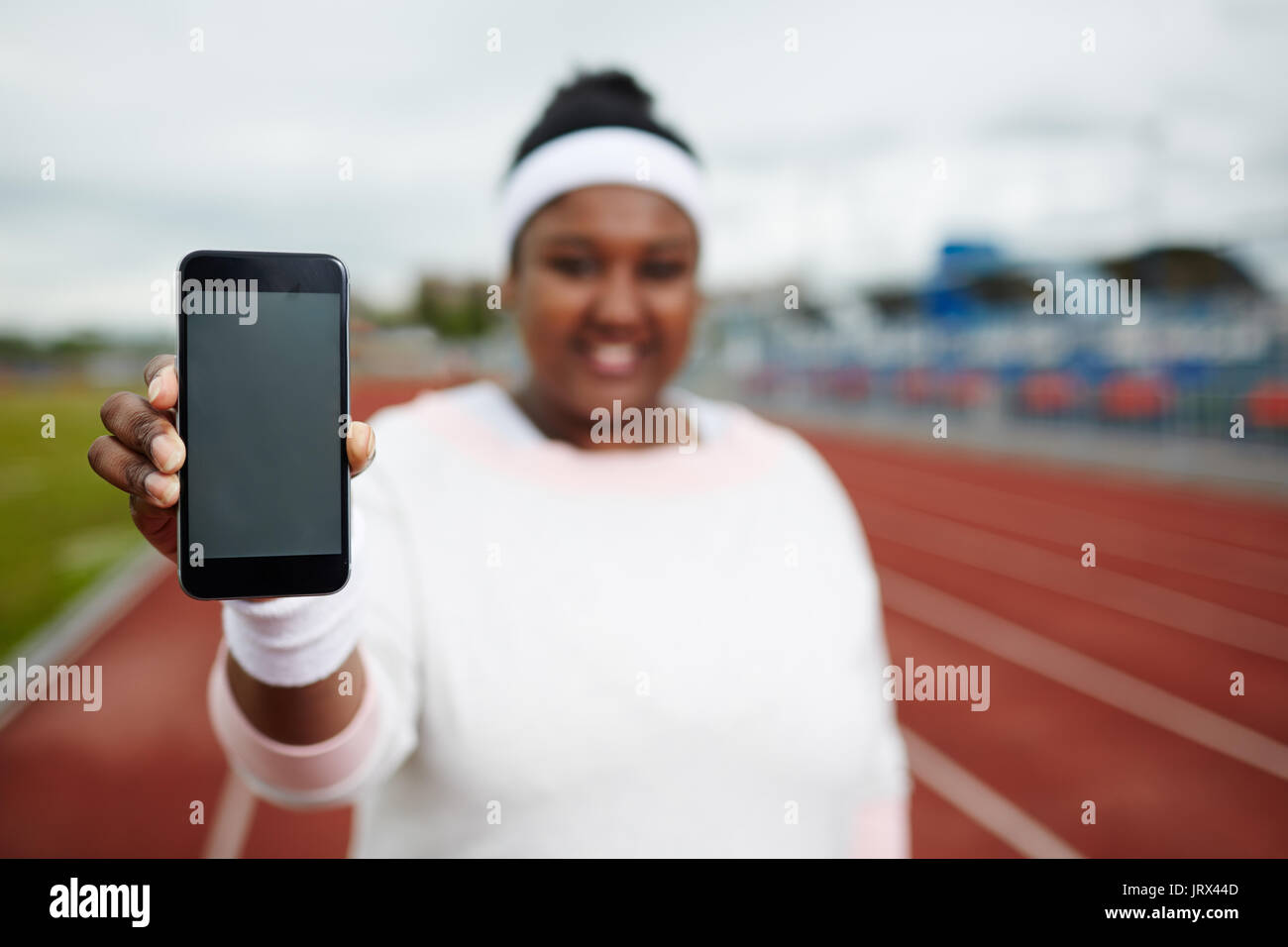 Using phone during workout Stock Photo - Alamy