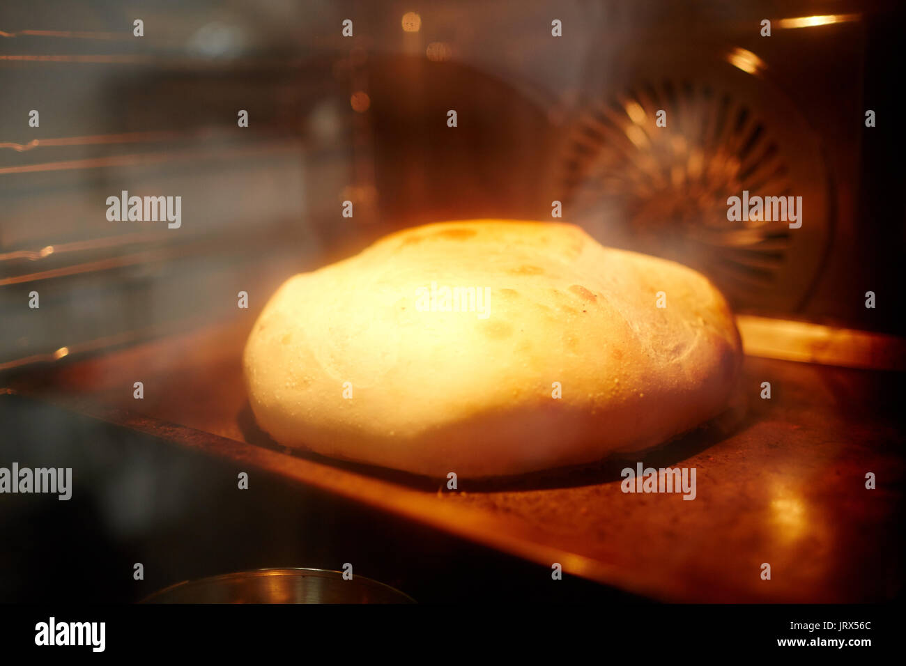Bread in oven Stock Photo - Alamy