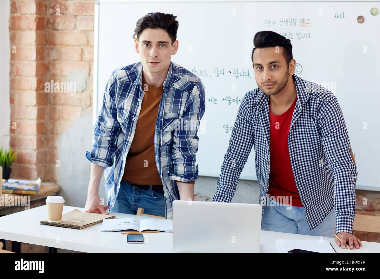 Guys in classroom Stock Photo - Alamy