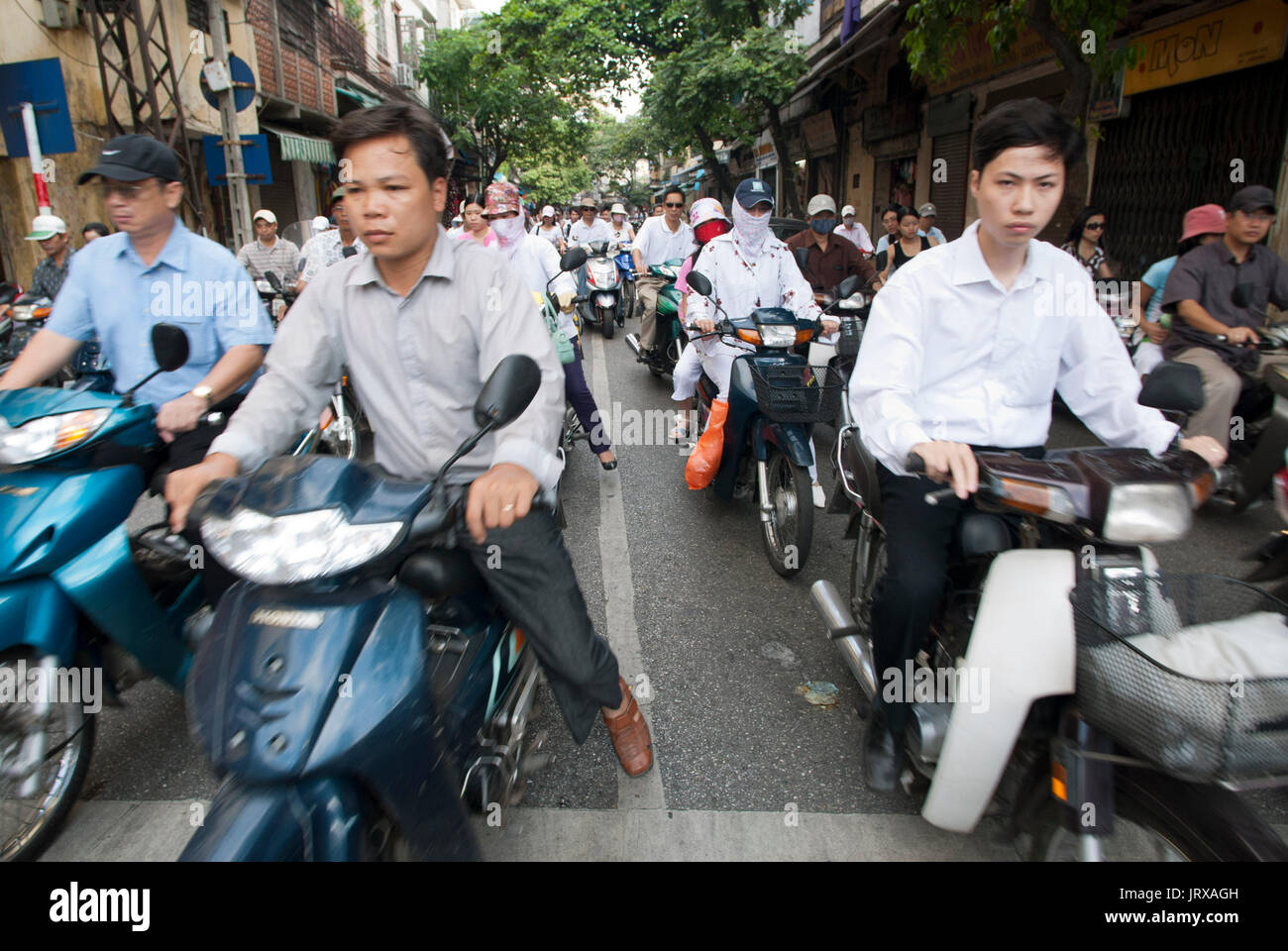 Motorcycles crowd streets of Hanoi Vietnam Stock Photo - Alamy