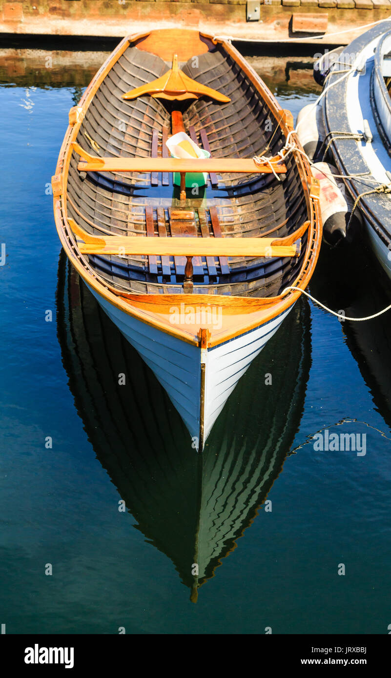 Rowboat and Reflection at Dock Stock Photo - Alamy