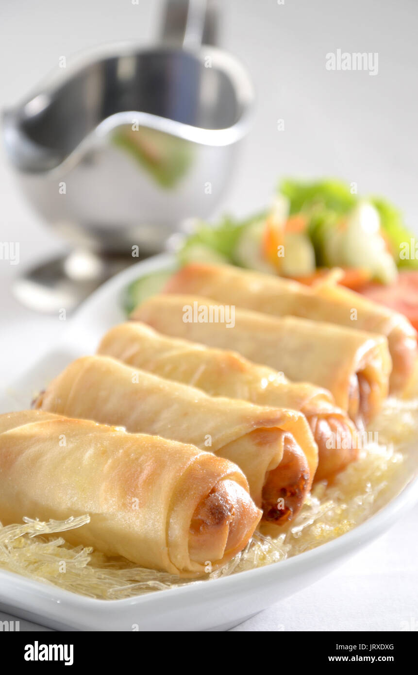 Indonesian Spring rolls served with garnish and sambal, chili paste ...