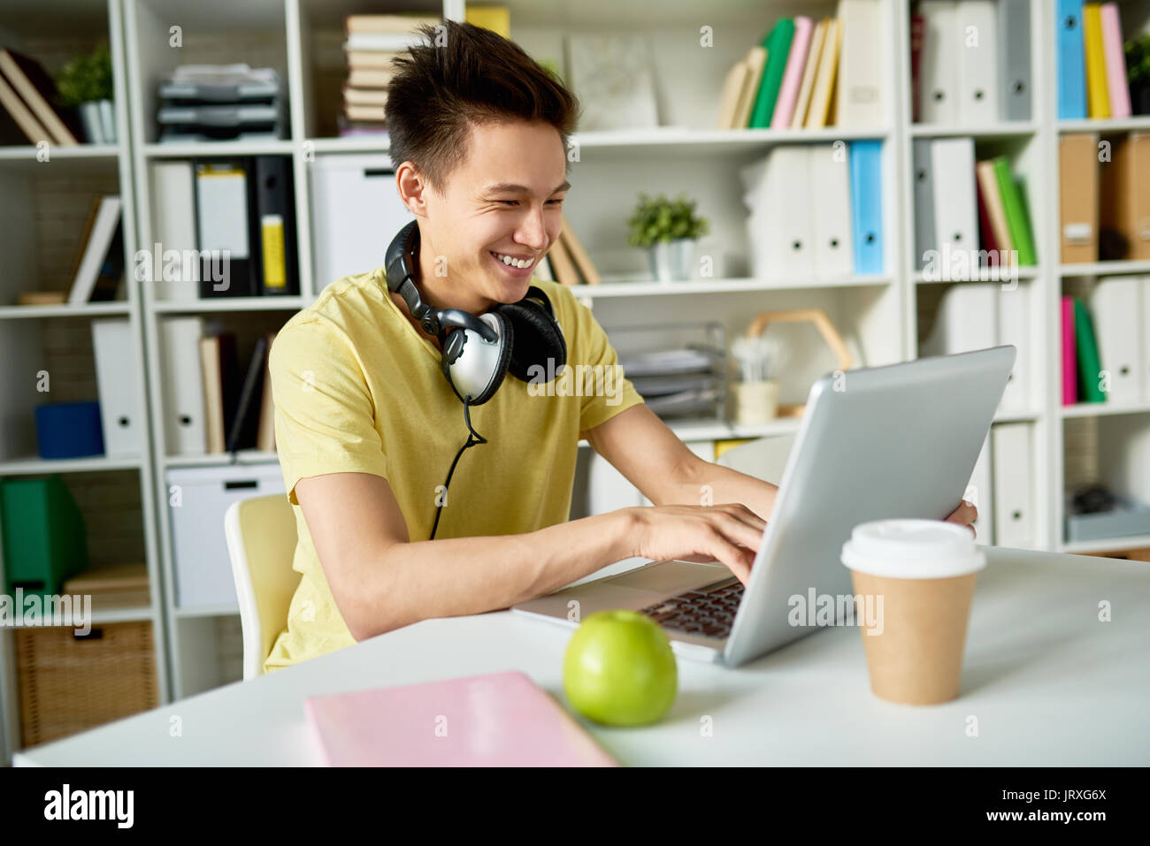 Happy Asian Student Using Laptop Stock Photo - Alamy