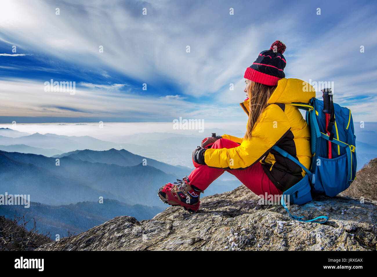 Girl sitting on high hill hi-res stock photography and images - Alamy