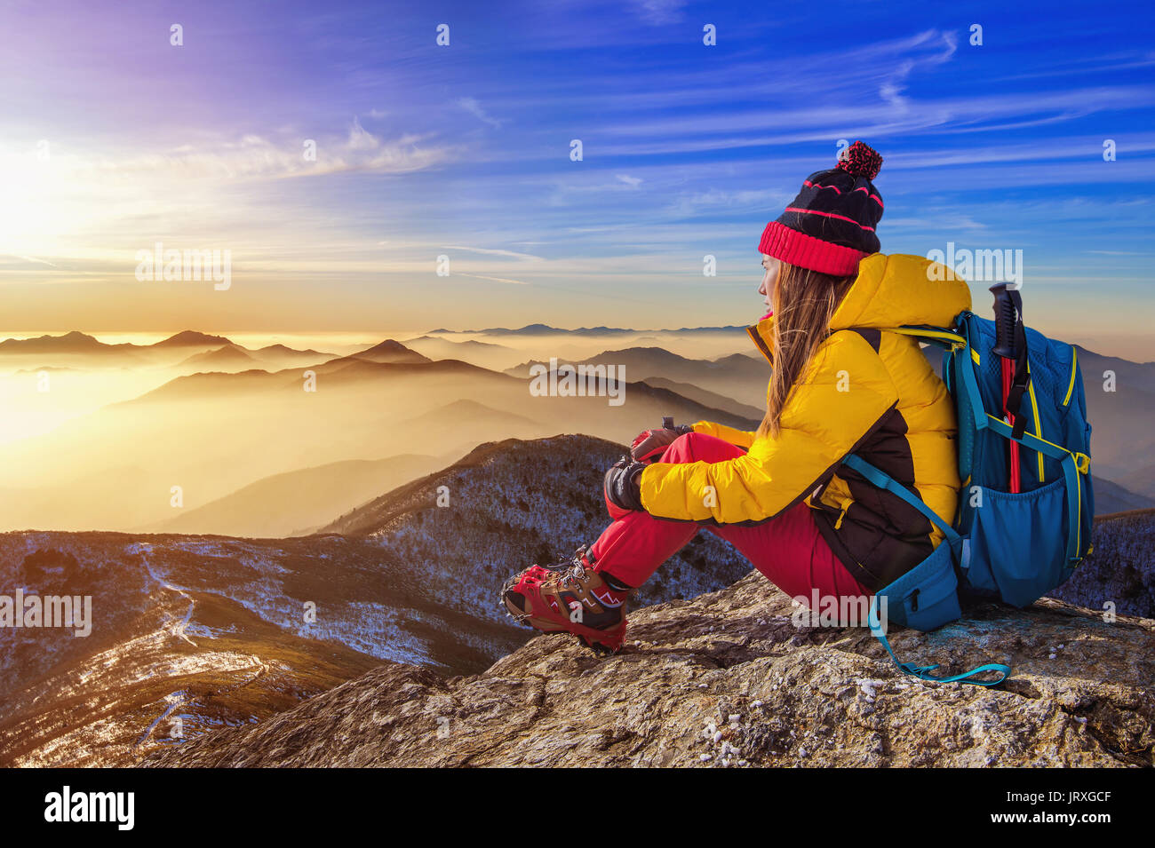 Girl sitting on high hill hi-res stock photography and images - Alamy