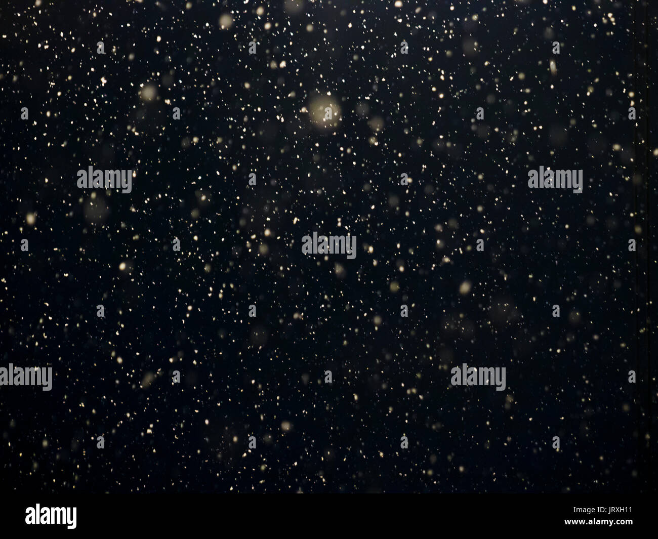 Background with snow falling in the night sky Stock Photo - Alamy