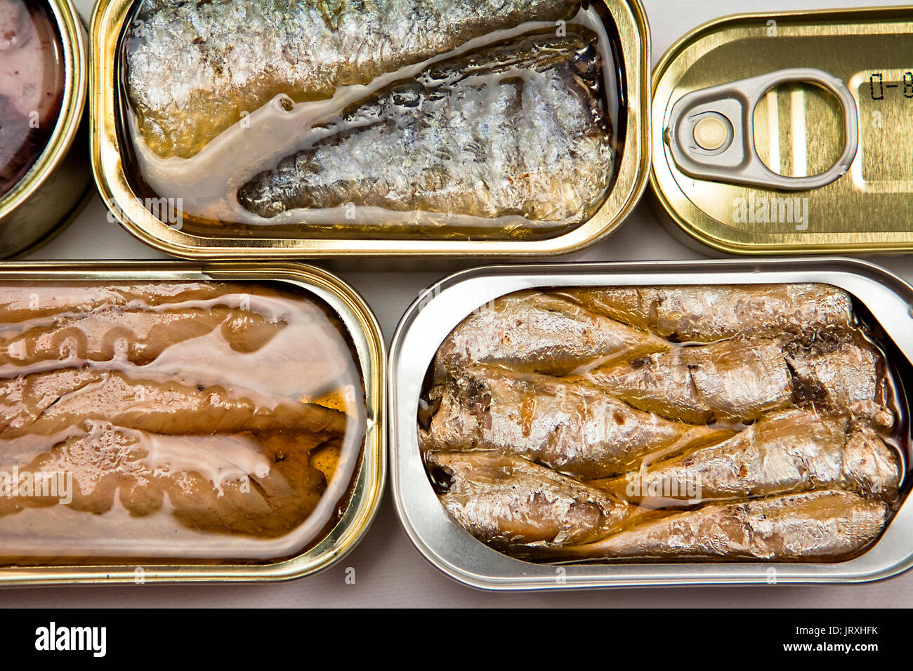 Tins of different sizes and opening Stock Photo - Alamy